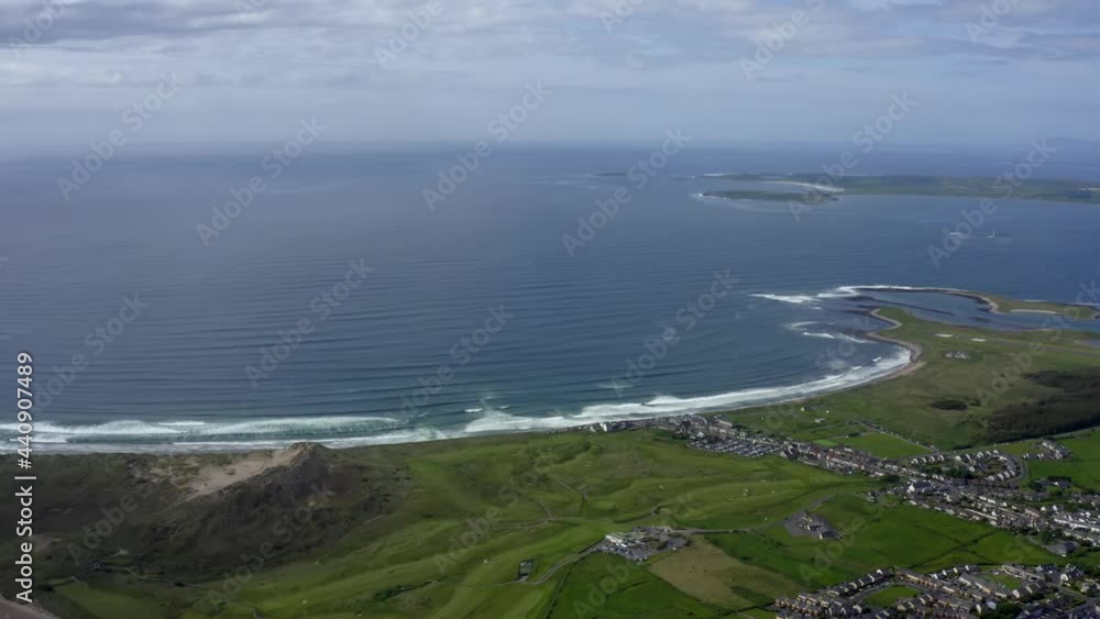 Sligo Bay, Ireland, June 2021. Drone slowly pushes towards the coast ...