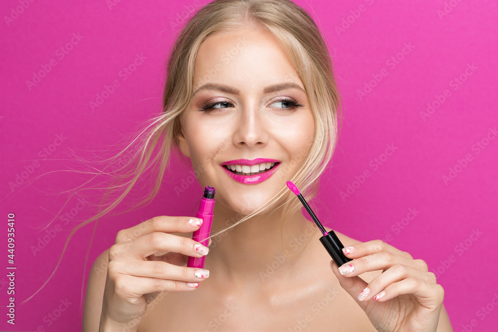 Applying Pink Lipstick