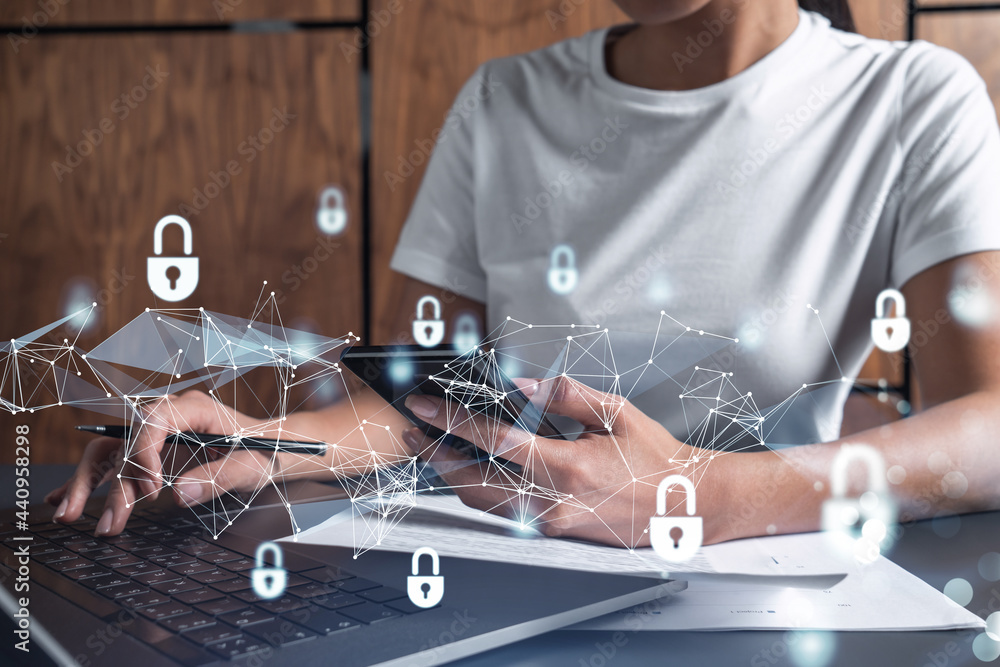 A woman programmer is typing a code on computer to protect a cyber ...