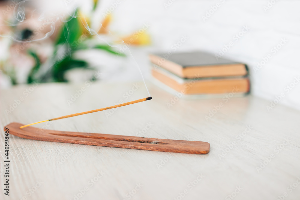 incense sticks on incense stands are on the table, an addition to the ...