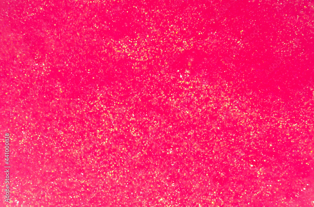 Saturated pink slime with golden glitter particle texture, top view ...