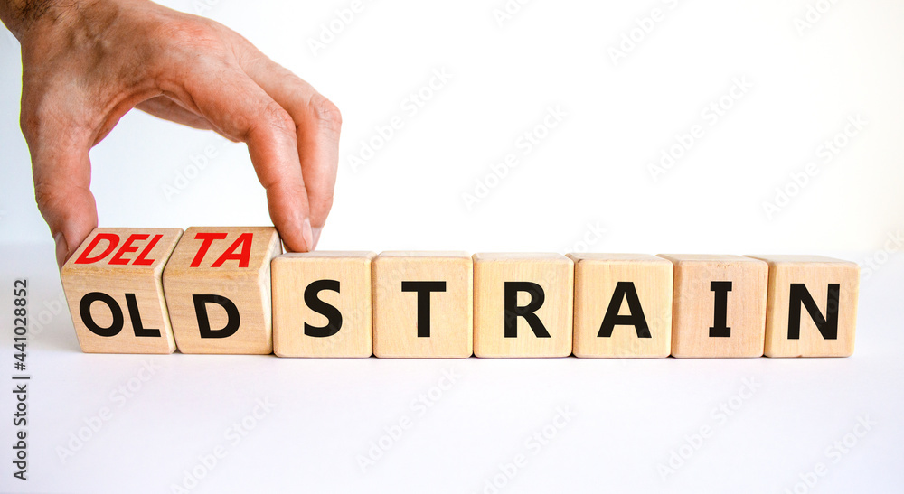 Covid-19 old or delta strain symbol. Doctor turns wooden cubes and ...