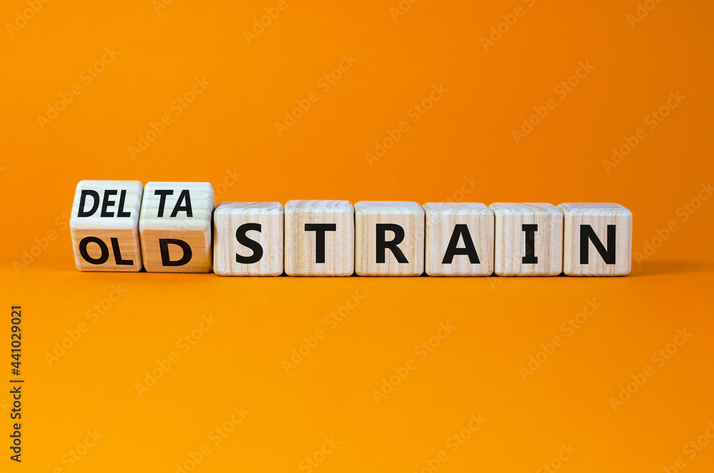 Covid-19 old or delta strain symbol. Turned wooden cubes and changed ...