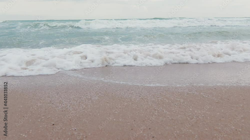 Front view with low angle 4K of sea beach seeing strong and turbulent ...