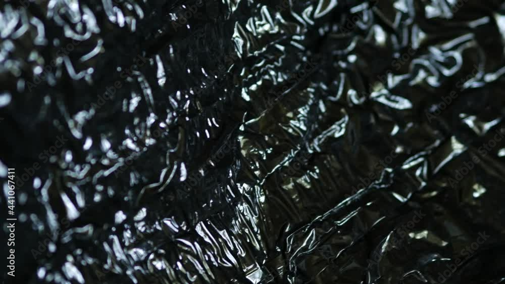 Video „Black plastic wrap or polyethylene bag. Crumpled vinyl ...