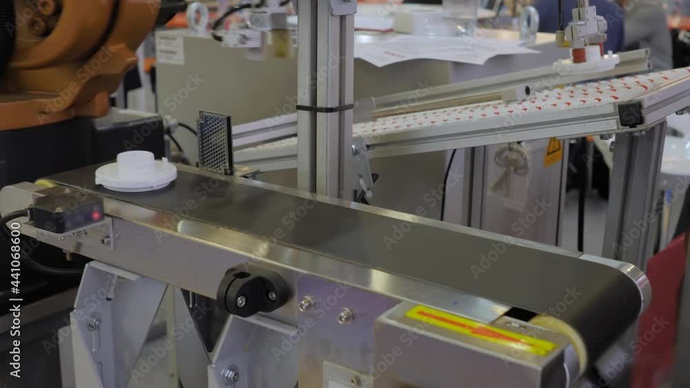 Pick and place robotic arm manipulator moving plastic detail on ...