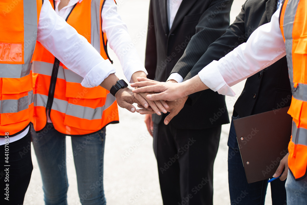Worker people and different nationalities fold their hands on each ...