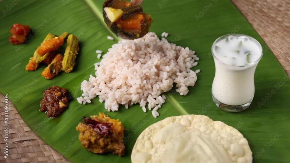 Serving sambar curry Onam sadhya Kerala Matta rice Kerala Red rice ...