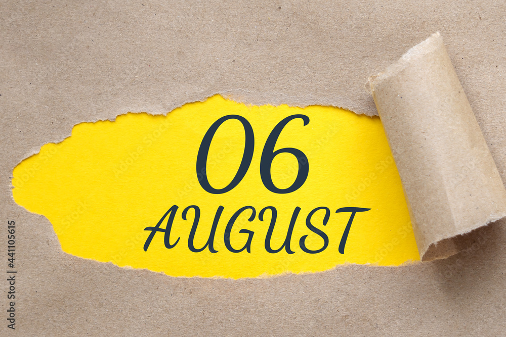 august 06. 06th day of the month, calendar date.Hole in paper with ...