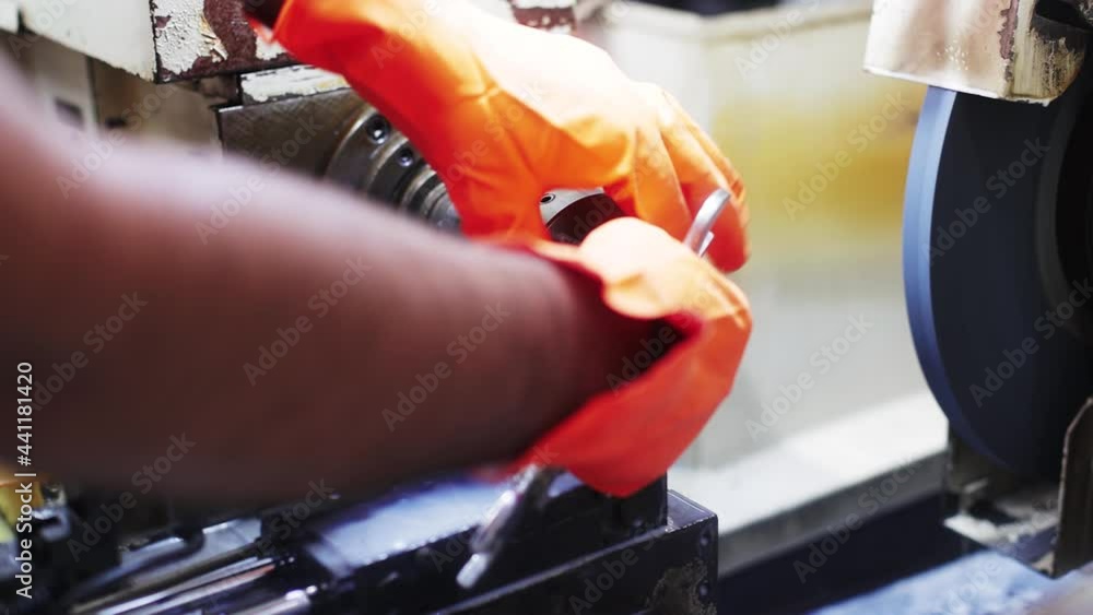 The turn-mill machine cutting groove at the metal shaft. The hi ...