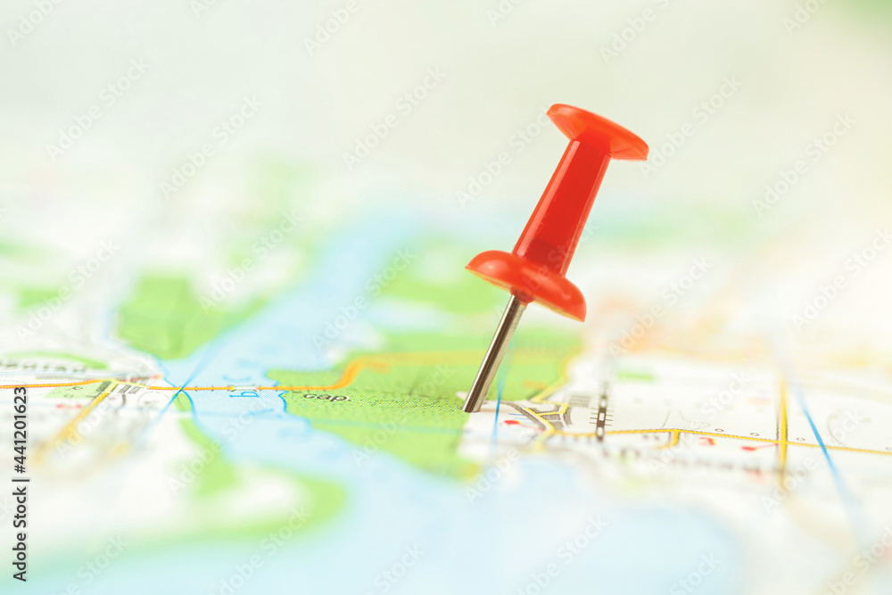 Selective focus of push pin on the map, red marker on navigation map ...