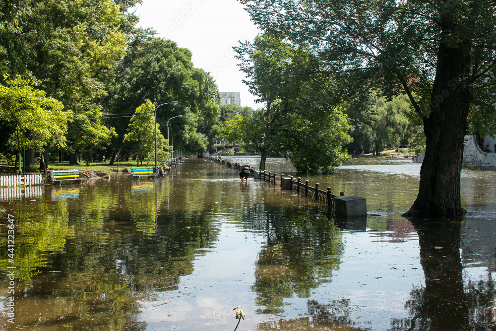 Public park drenched in rain. Water logged park.Wet benches. Park ...