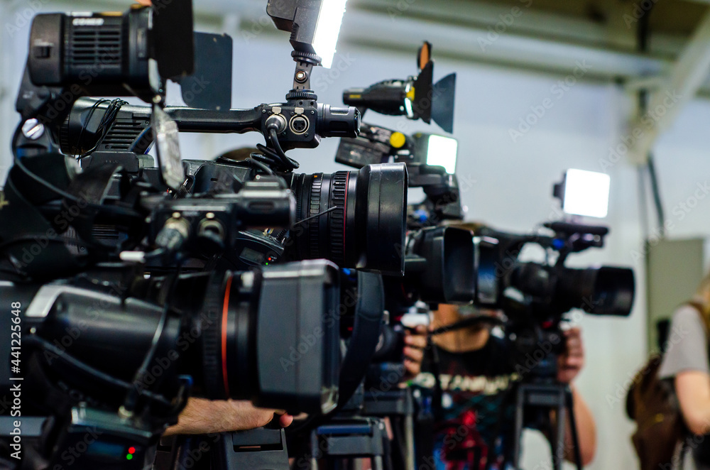 Press conference. Reporters are filming on TV cameras. Stock Photo ...