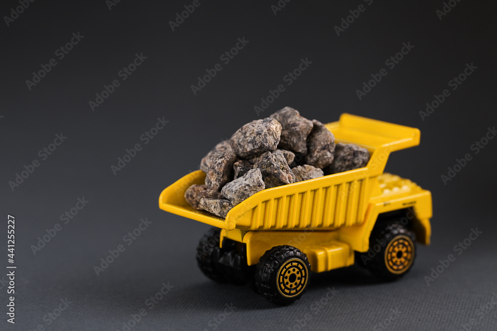 Yellow loader delivering stone gravel. Delivering stone. Dump Truck on ...