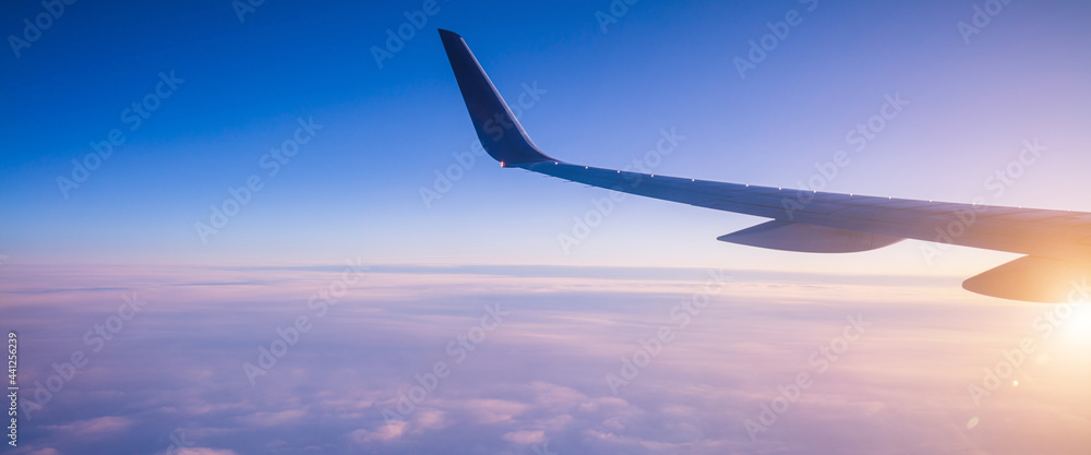 Top view from inside window airplane of a sunset sky and wing Stock ...