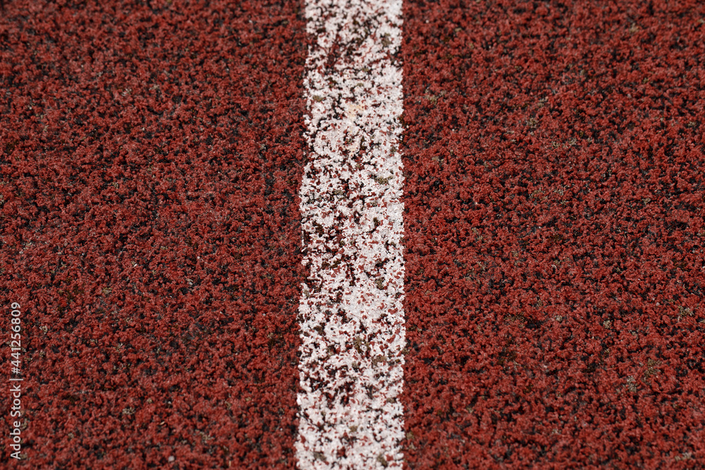 Red racing track with white line rubber texture in stadium texture ...