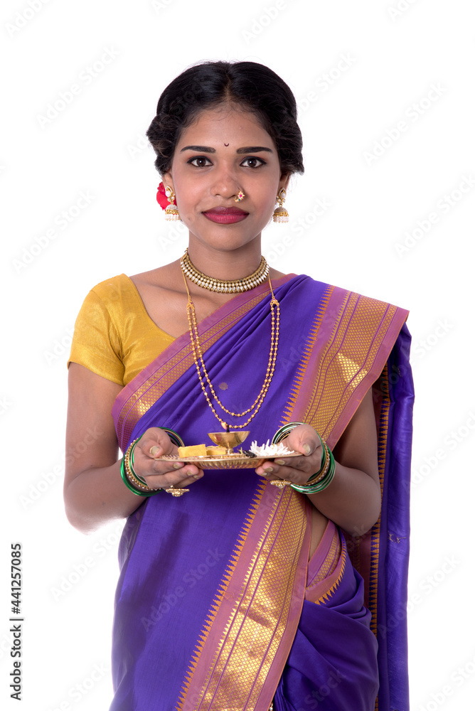 Indian woman performing worship, portrait of a beautiful young lady ...