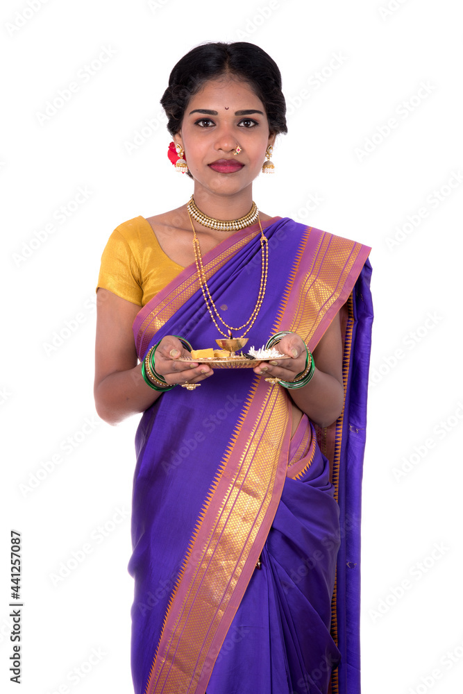 Indian woman performing worship, portrait of a beautiful young lady ...