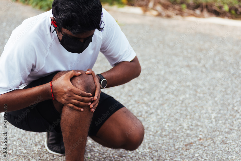 Close up Asian young sport runner black man wear watch sitting hands ...
