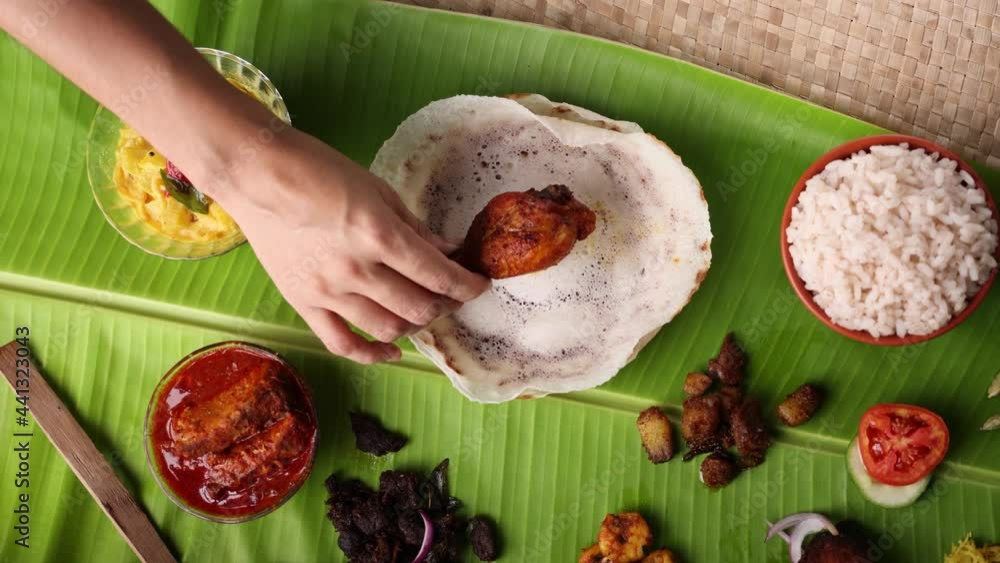 Hand serving chicken fry Appam Non-vegetarian sadhya Indian food Onam ...