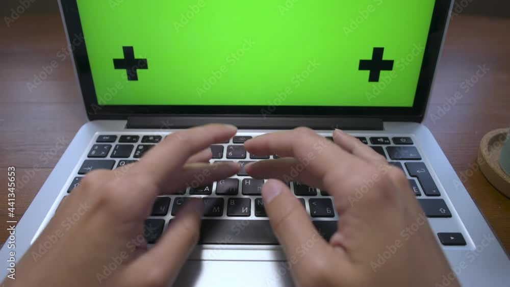 Woman hands typing and scrolling on a trackpad in a laptop computer ...