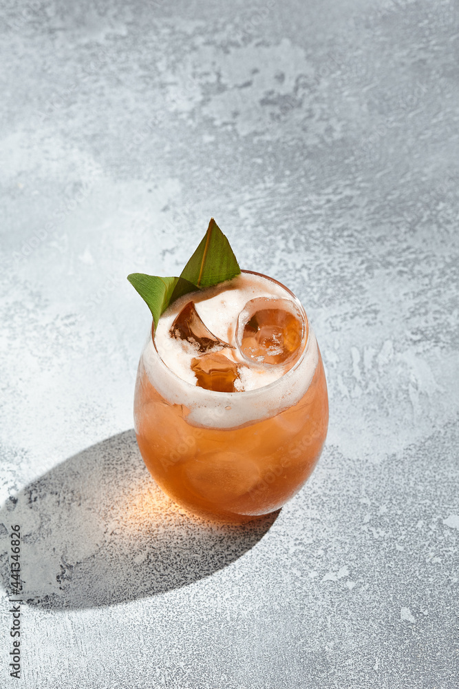 Aperol Spritz Cocktail with foam from egg white. Rox Cocktail glass on ...