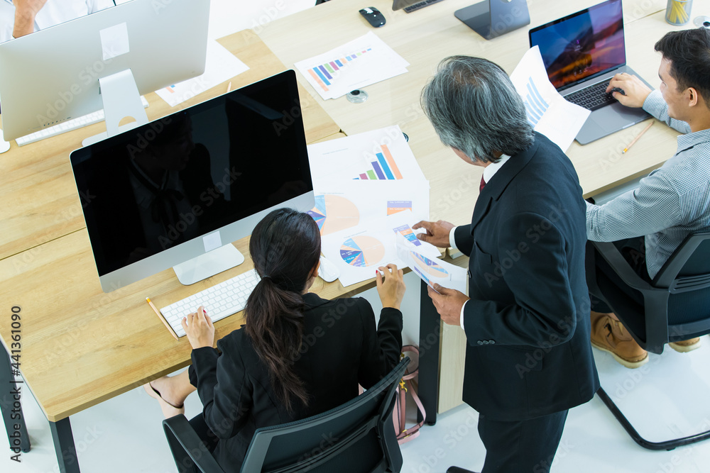 Senior staff in a suit is ordering a female employee to view ...
