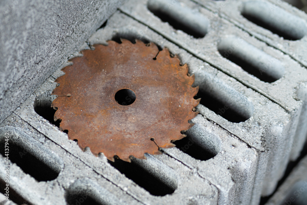 A rusty cutting blade of the electric saw or grinder machine which is ...
