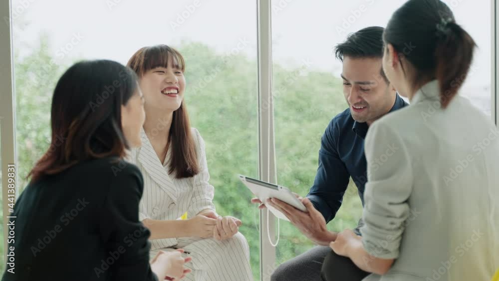 50p frame rate footage of Employees of a business group are holding a ...