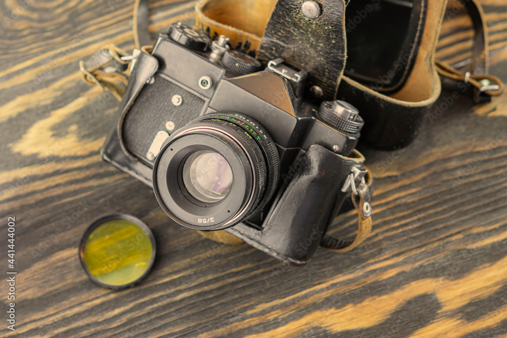 Retro film camera,old with a cover camera with a lens and a polarizing ...
