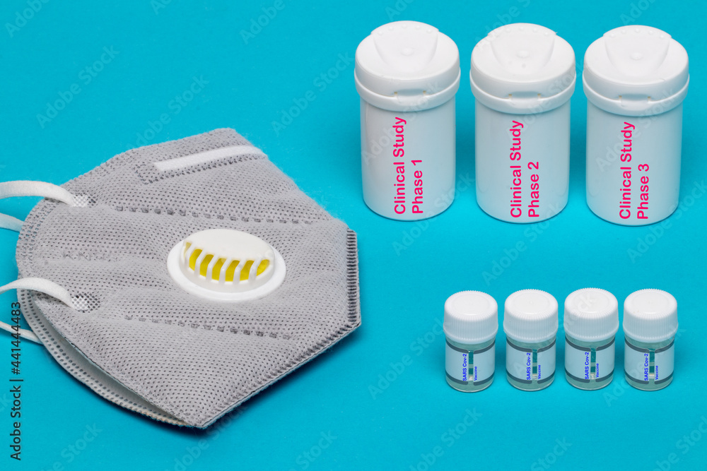 Closeup of a face mask and mRNA vaccine that is up to 90 percent ...