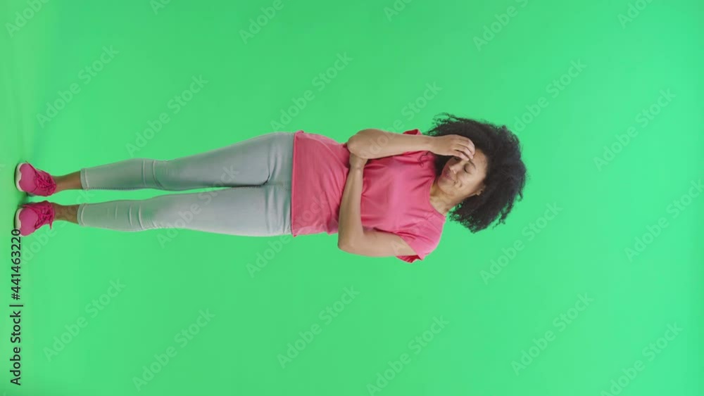 Portrait of young female African American suffering from headache from ...