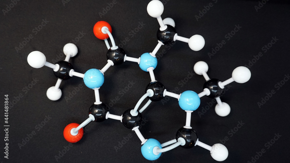 Model of a caffeine molecule (C8 H10 N4 O2) on a black background Stock ...