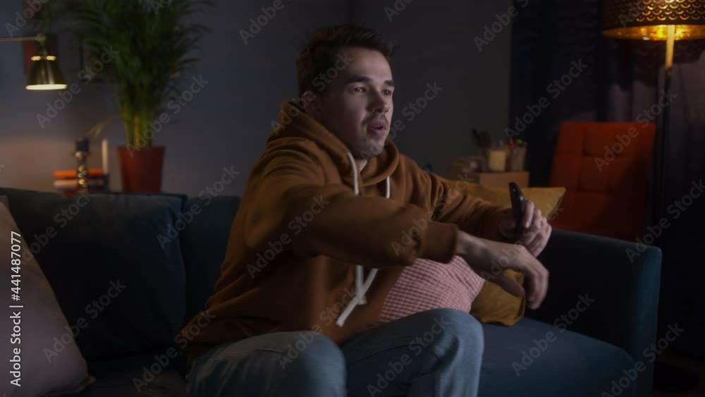 Excited man watching entertainment show on TV, next gen 2020, Happy ...