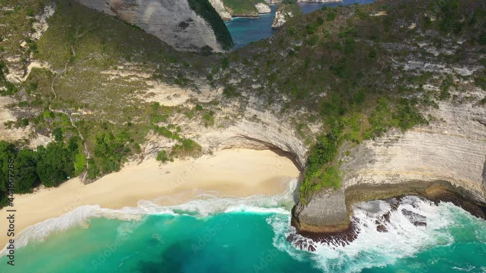 Dramatic aerial drone footage of the famous Kelingking beach, aka T Rex ...