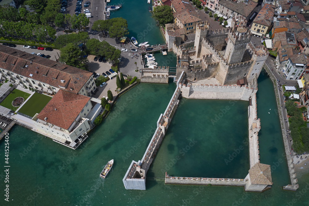 Flag of Italy on the towers of the castle on Lake Garda. Top view of ...