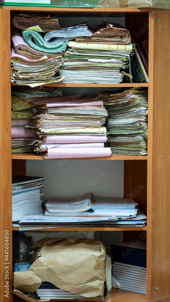 Old office cabinet filled with folders and paper documents Stock Photo ...