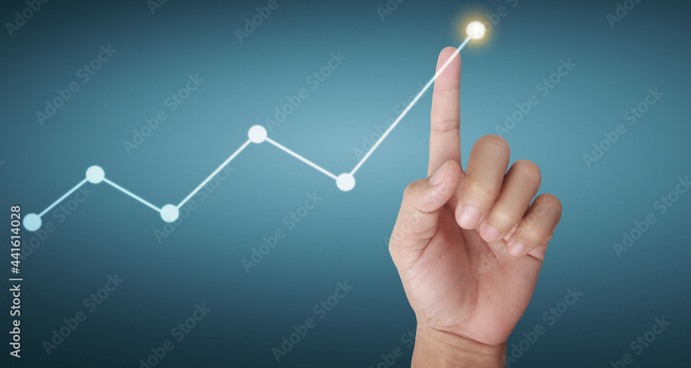 Hand touching graphs of financial indicator and accounting market chart ...