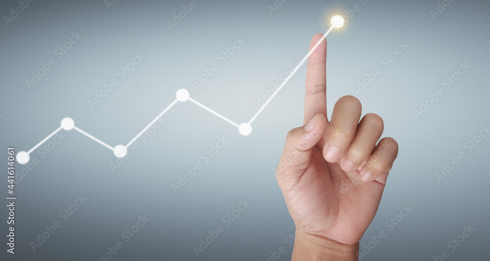 Hand touching graphs of financial indicator and accounting market chart ...