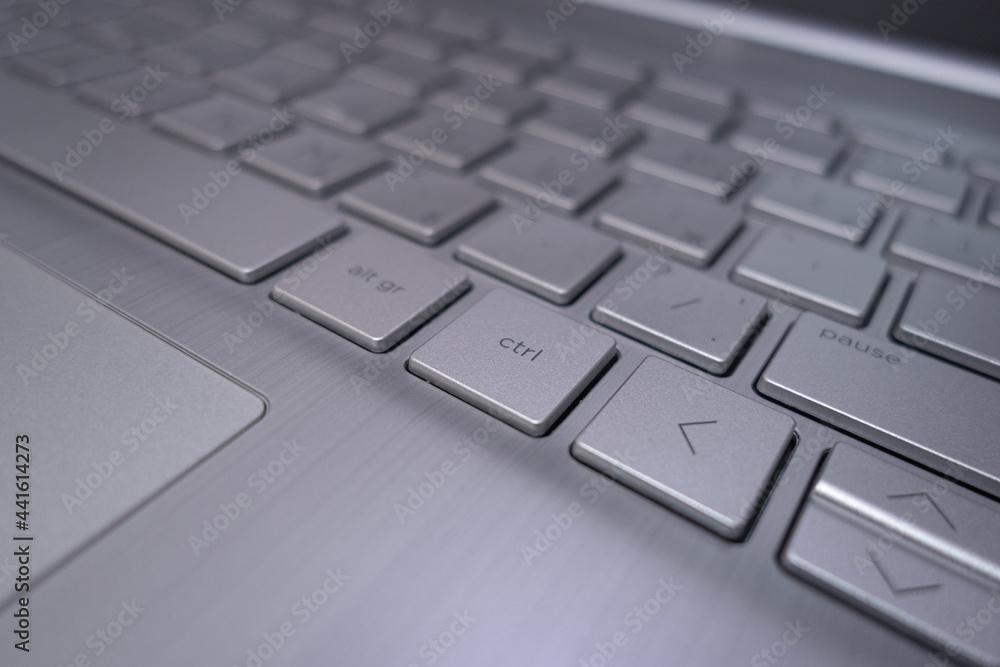 Close-up: laptop keyboard and touchpad. The aluminum surface. Stock ...