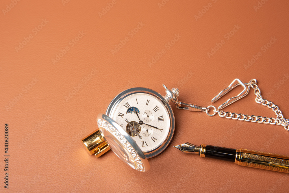 Fountain pen and clock, beautiful details of a fountain pen and an ...