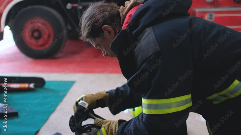 Video „Close up side view of fireman or firefighter check and ...