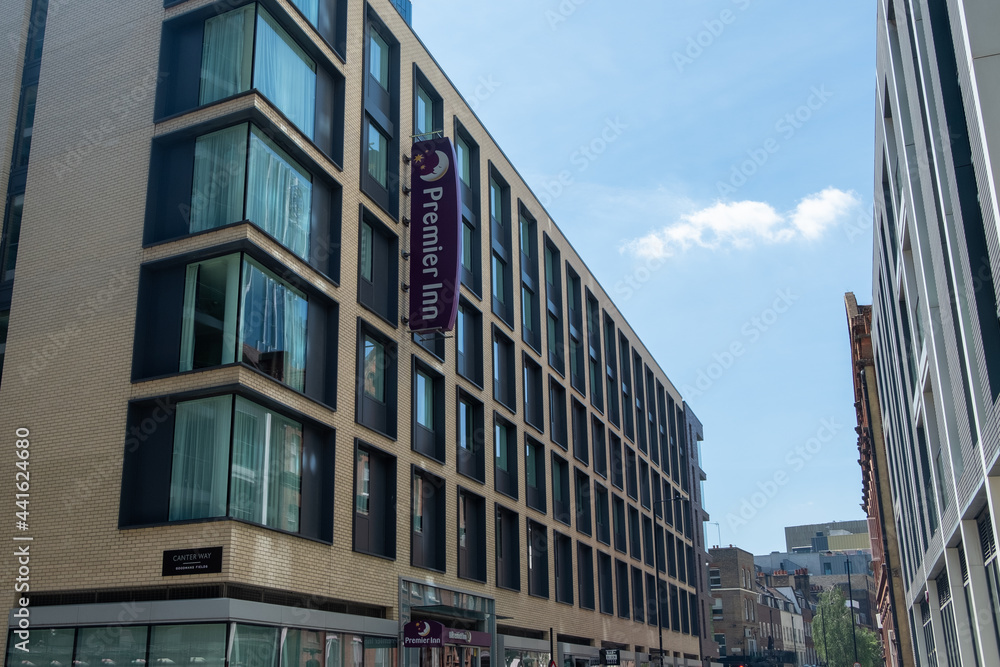 London: Premier Inn logo on exterior of hotel in Aldgate, City of ...