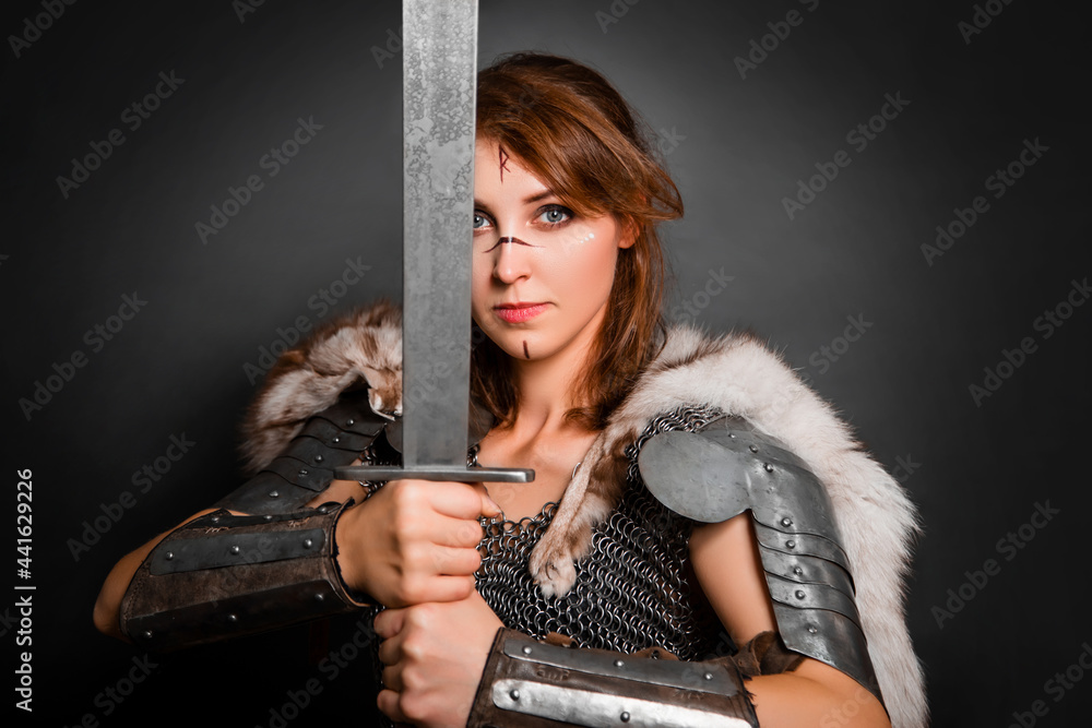 Medieval woman warrior in chain mail armor and polar fox fur on her ...
