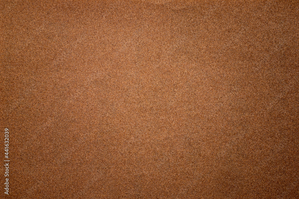 Sandpaper texture background where you can see the red-brown sand grain ...