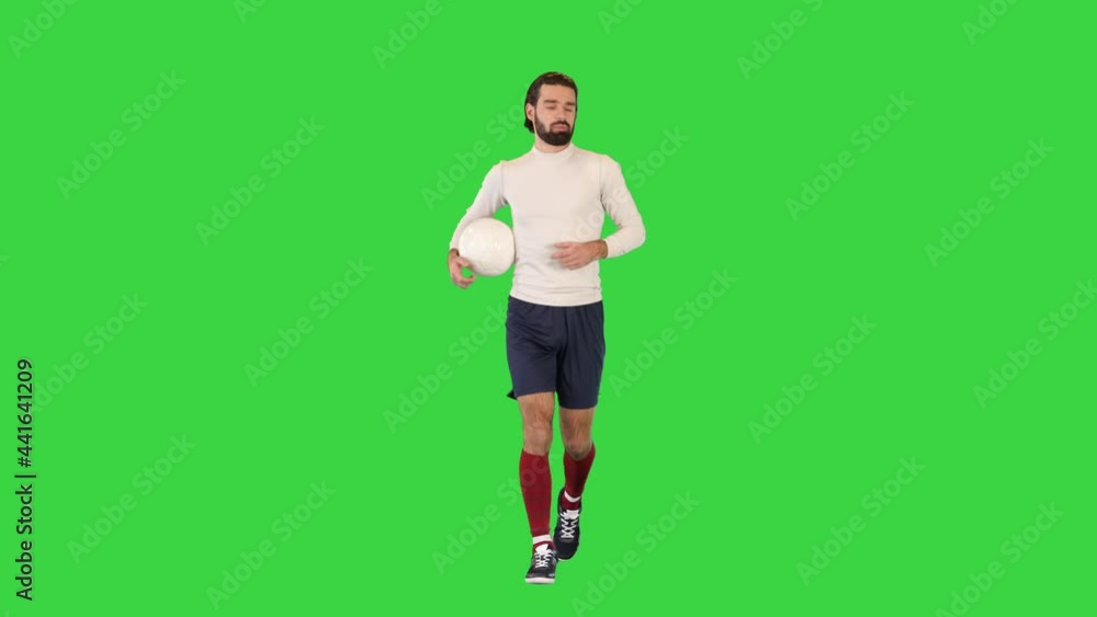 Young Male Soccer Player Running With A Ball In Hands on a Green Screen ...