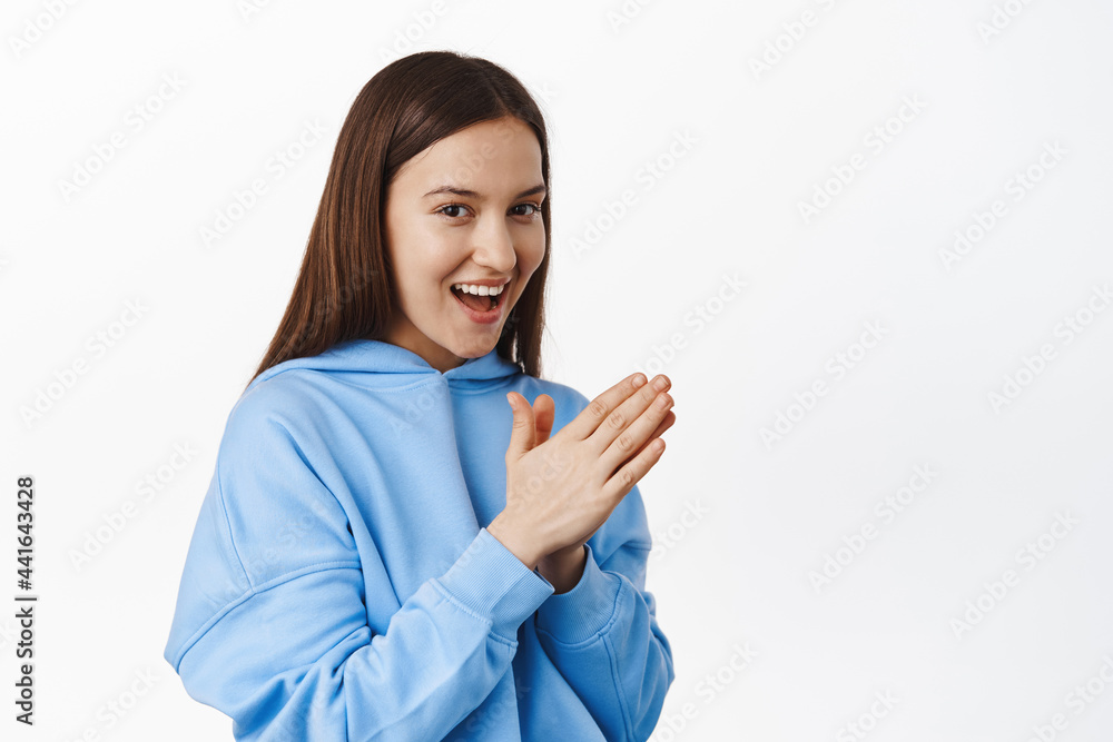 Evil genius face. Smiling young girl plan smth, relish money, rub hands ...