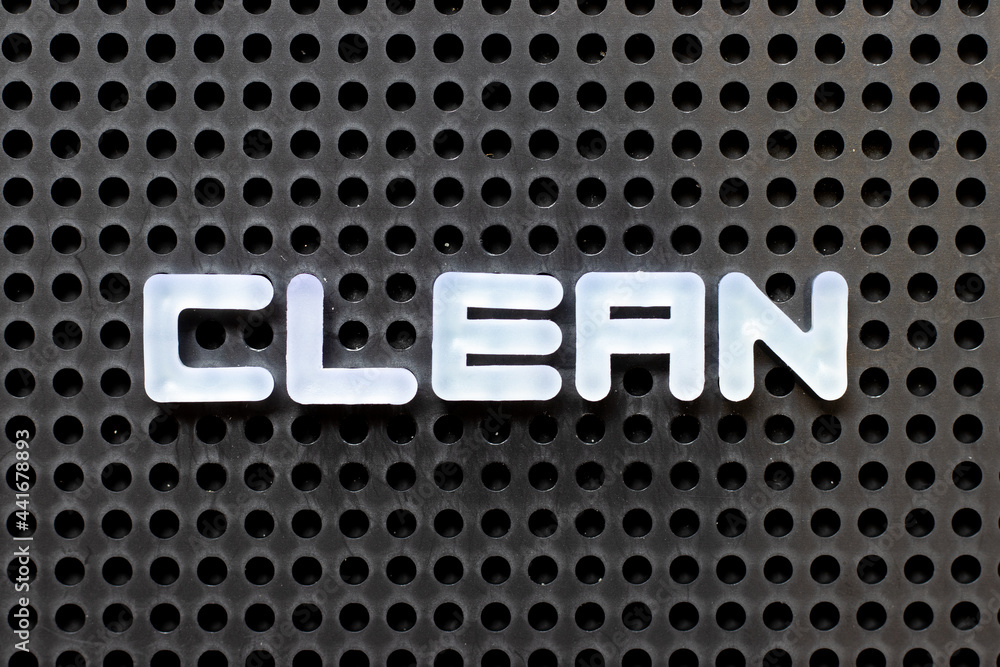 White color alphabet with word clean on black pegboard background Stock ...