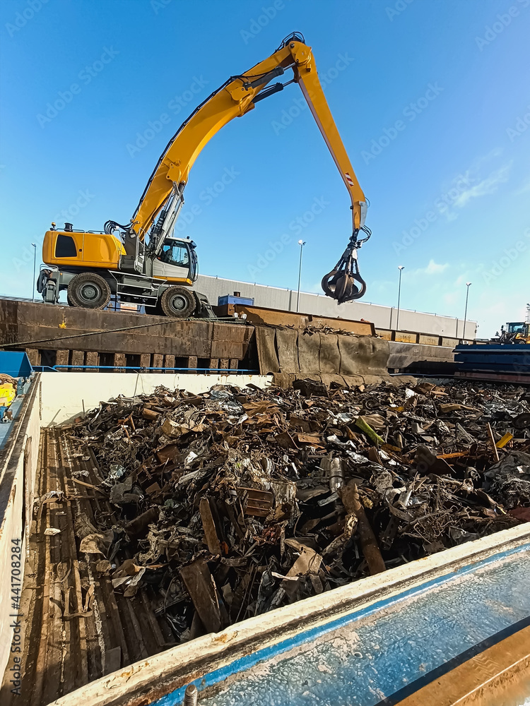 Poster loading and unloading of scrap metal in the port/ Equipment in ...