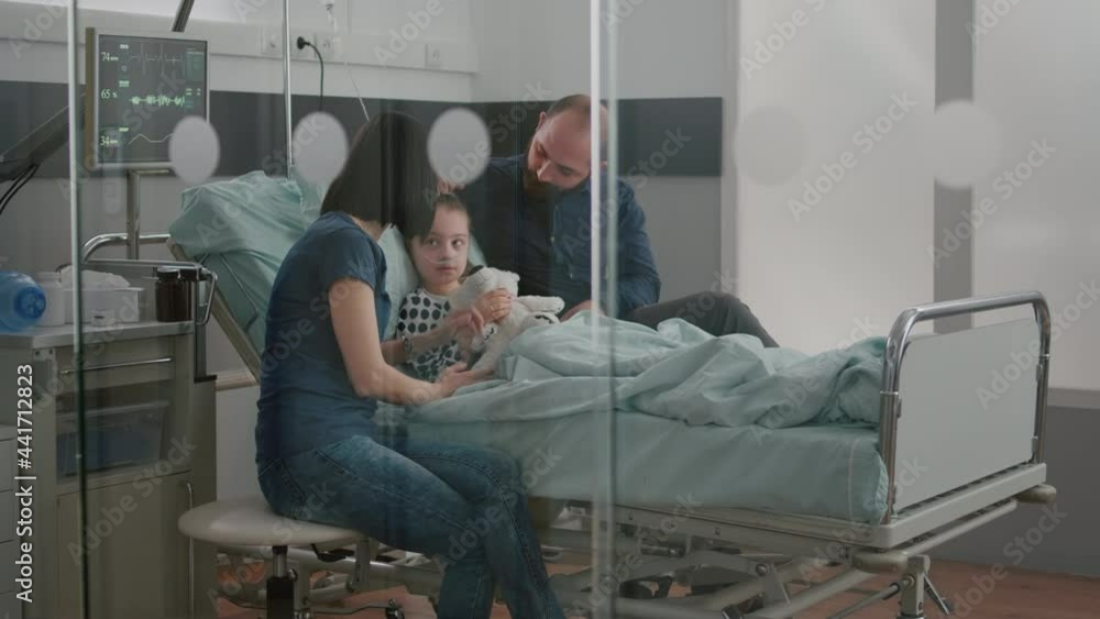 Worried parents sitting with sick girl daughter waiting for sickness ...
